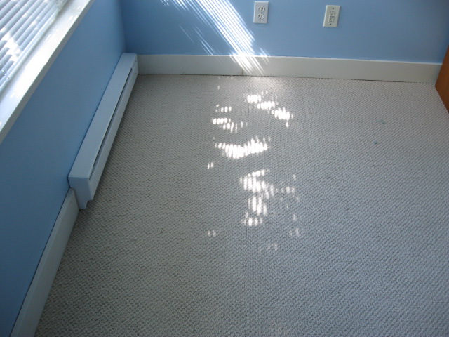 Big Stain in carpet and so big Patch was put in - Curlys Carpet Repair